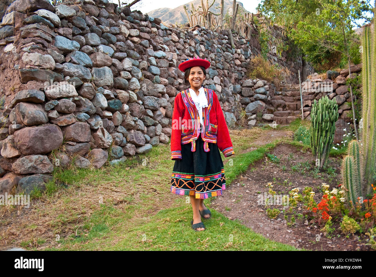 Cusco, Peru, A local girl in traditional clothing walks in the Sacred ...