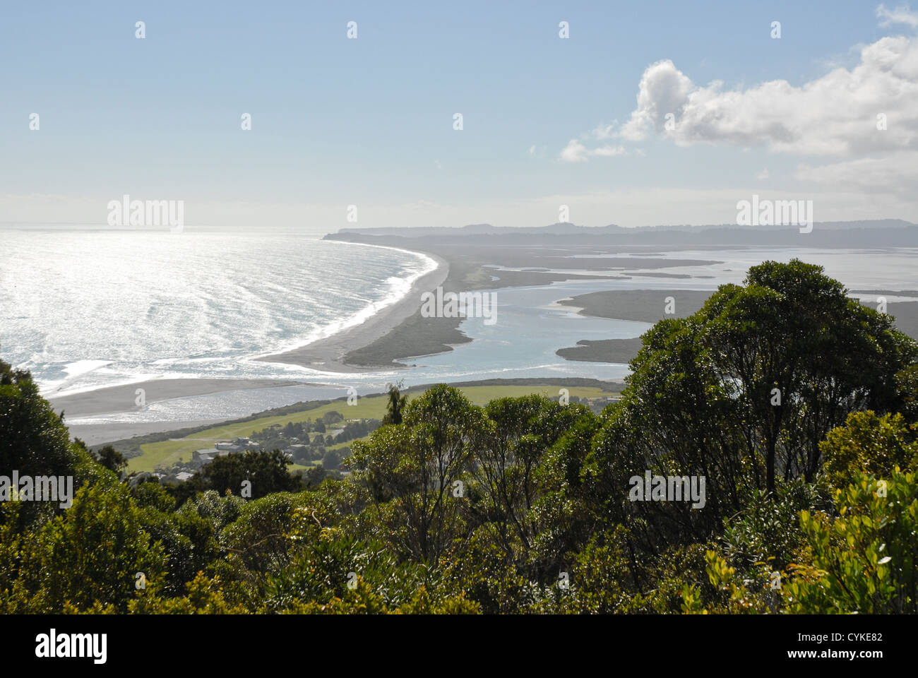 View across Okarito Lagoon and the barrier beach. South Island, New ...
