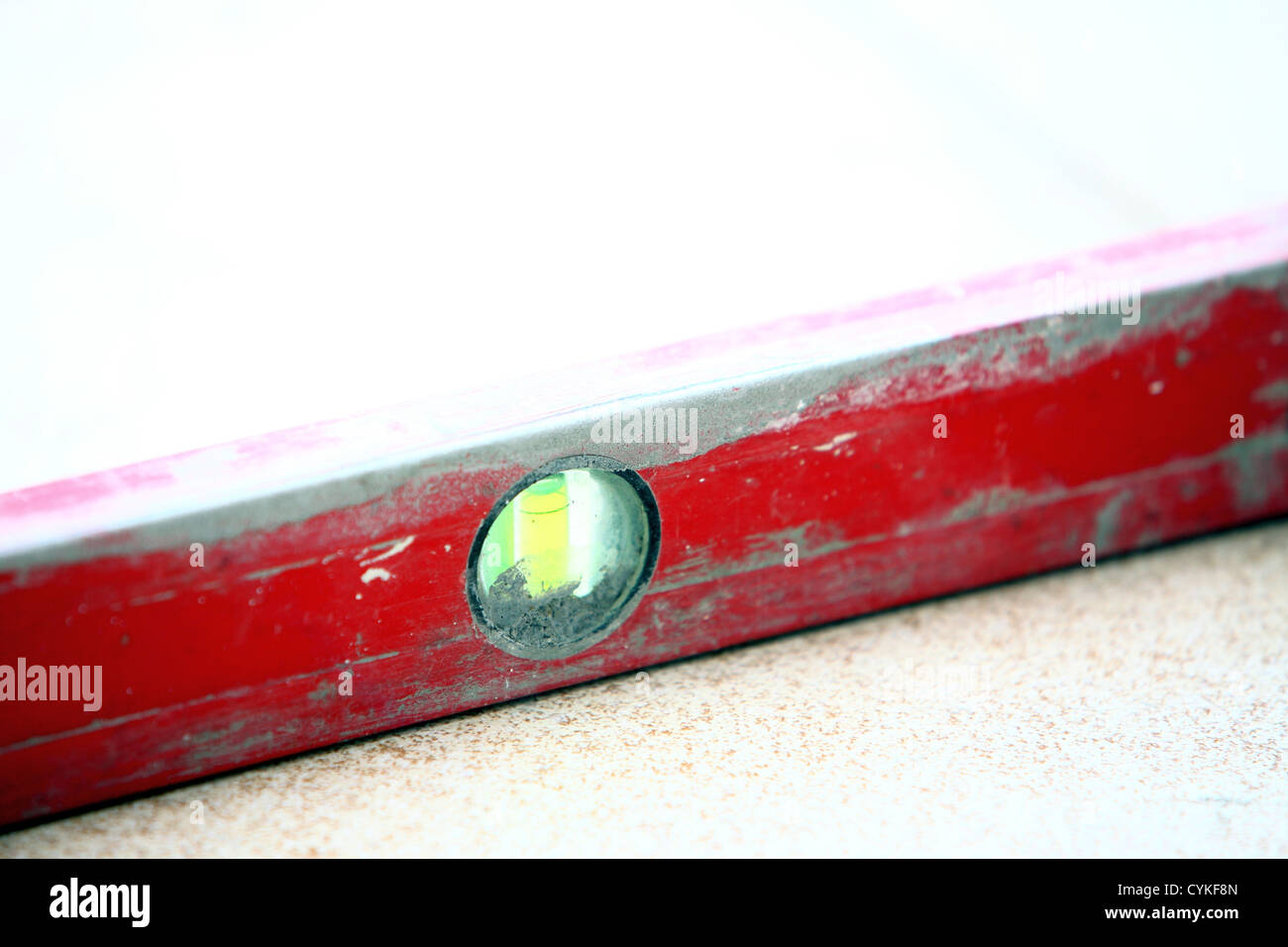 level Construction worker is tiling at home, tile floor adhesive Stock ...