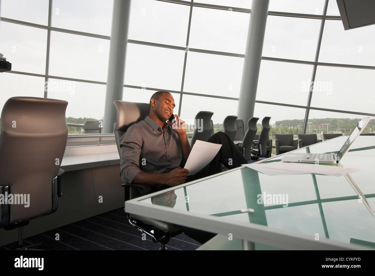 Black businessman working in conference room Stock Photo - Alamy