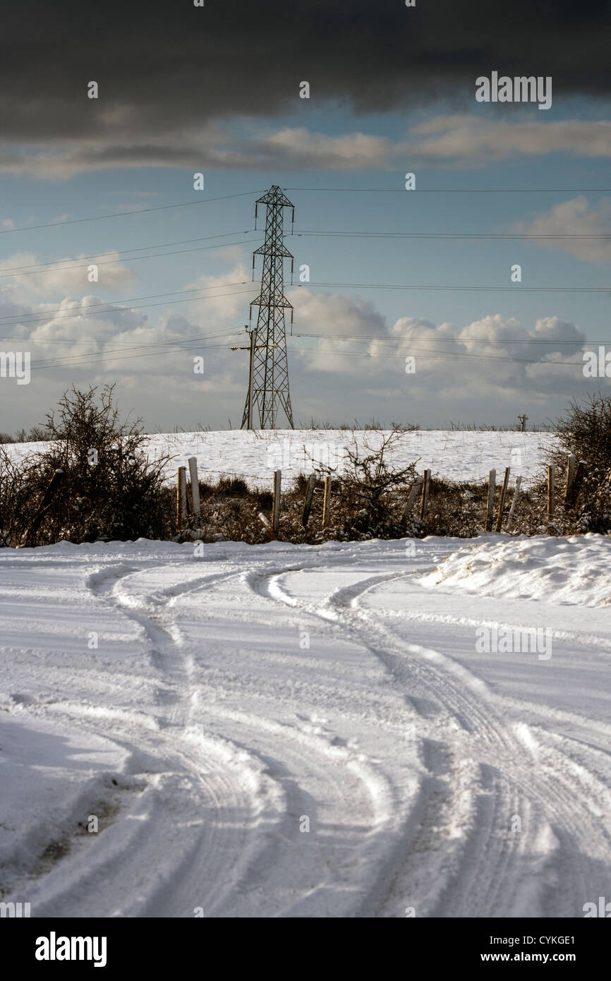 Pylon beside a snow covered road hi-res stock photography and images ...