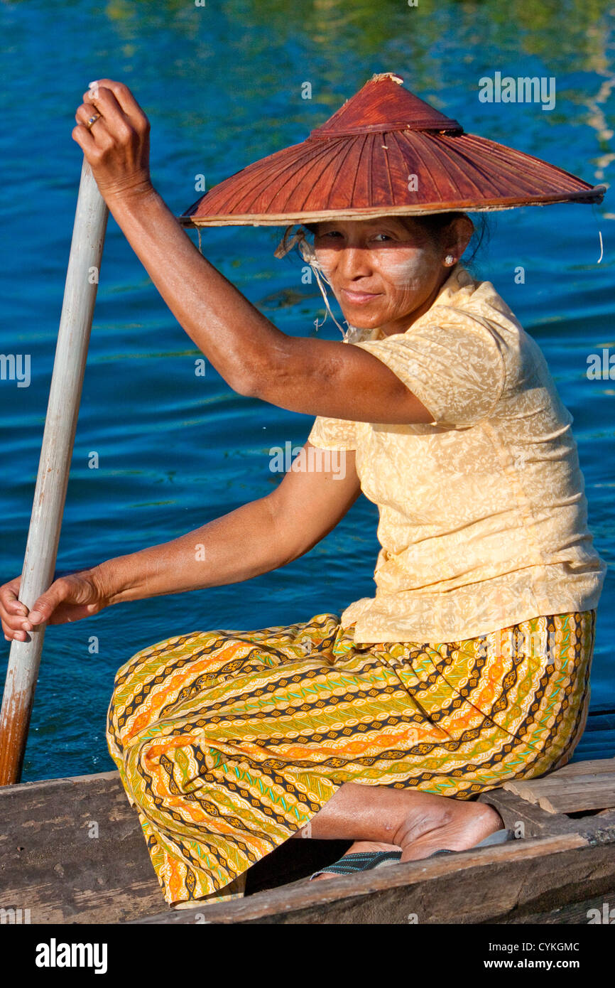 Myanmar, Burma. Woman of Intha Ethnic Group Rowing her Canoe, Inle Lake ...
