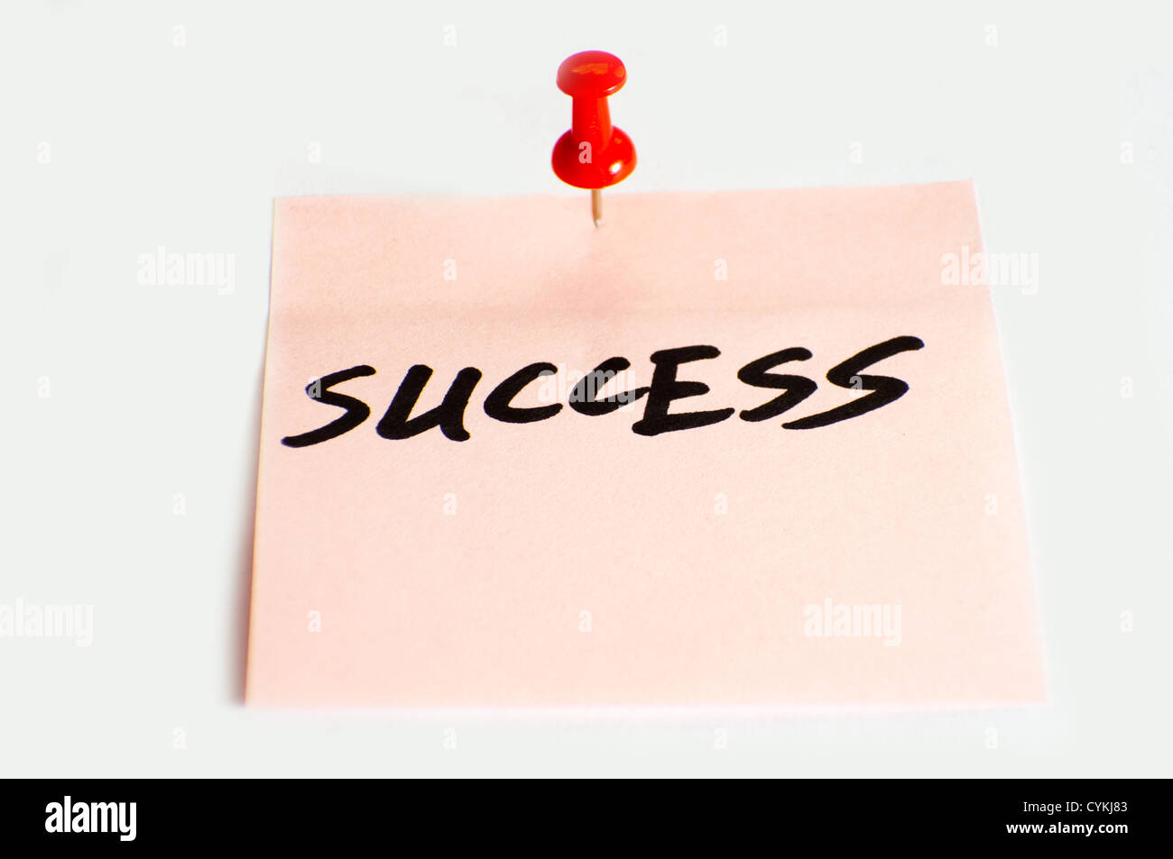 Write a note of success pins set in the wall Stock Photo - Alamy