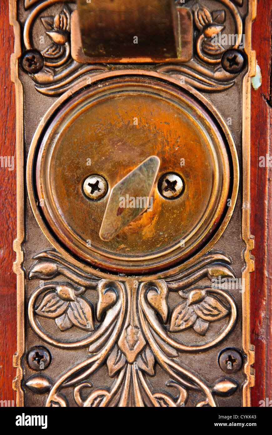 Color photo of a metal handle on a wooden door Stock Photo - Alamy