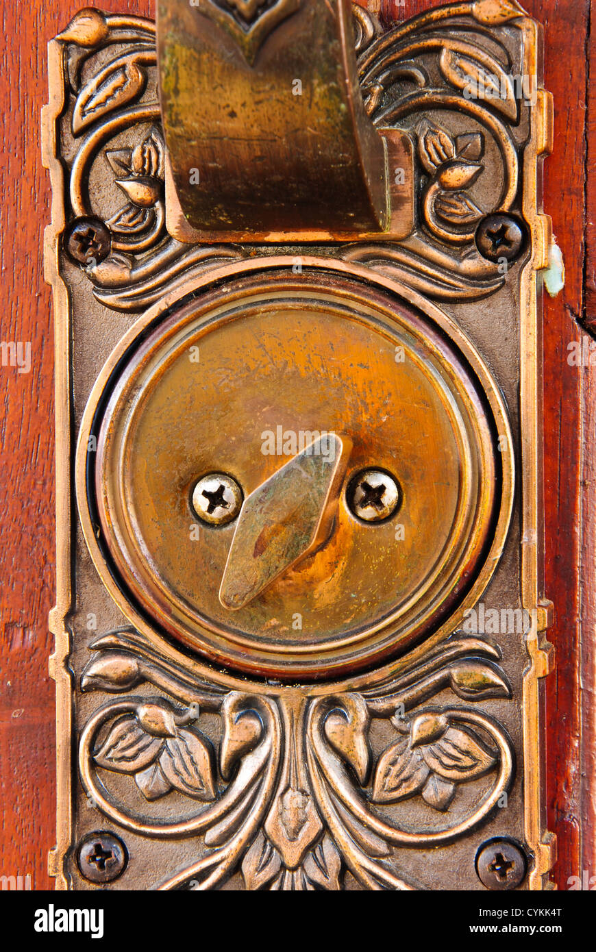Color photo of a metal handle on a wooden door Stock Photo - Alamy