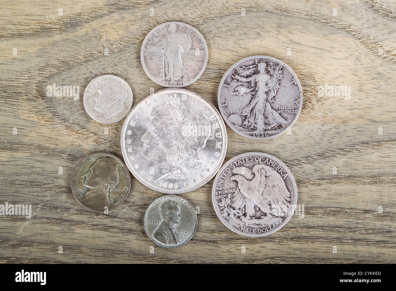 Old Silver Coins on faded white ash wood background Stock Photo - Alamy