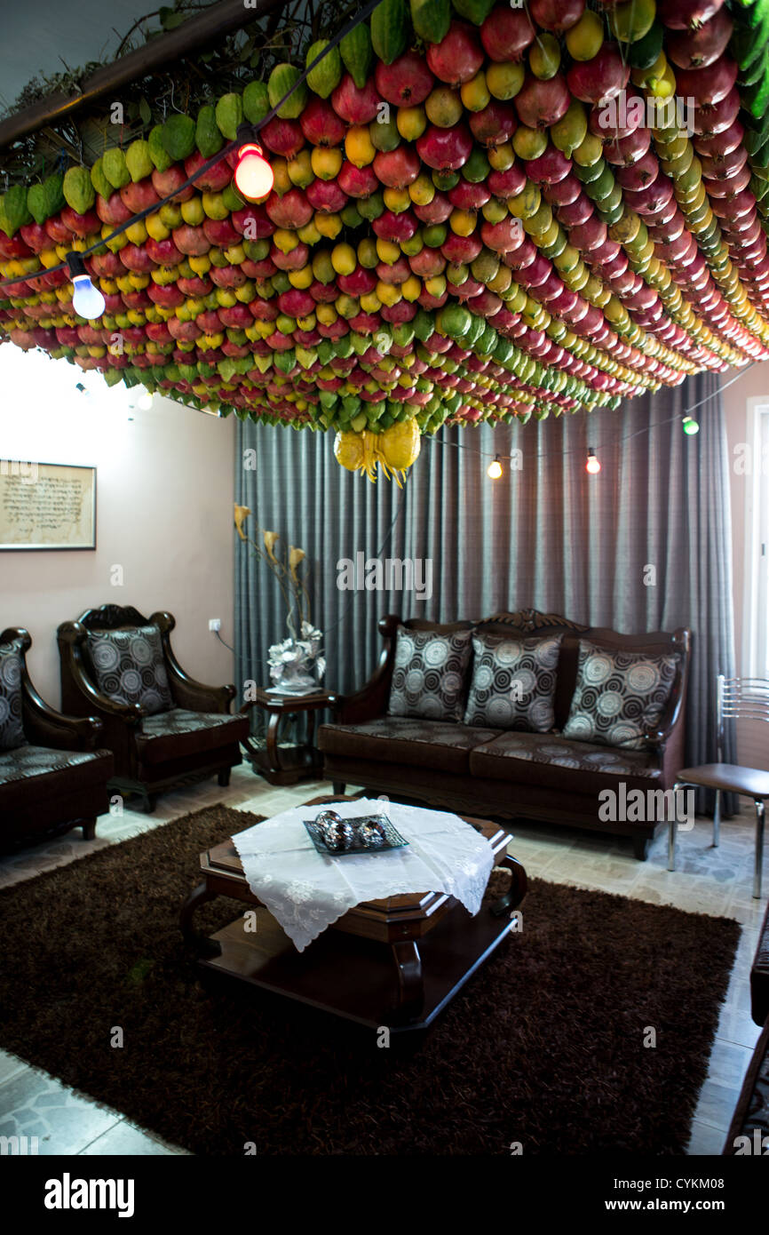 Samaritan indoor Sukkah is decorated with fresh fruit on the ceiling ...