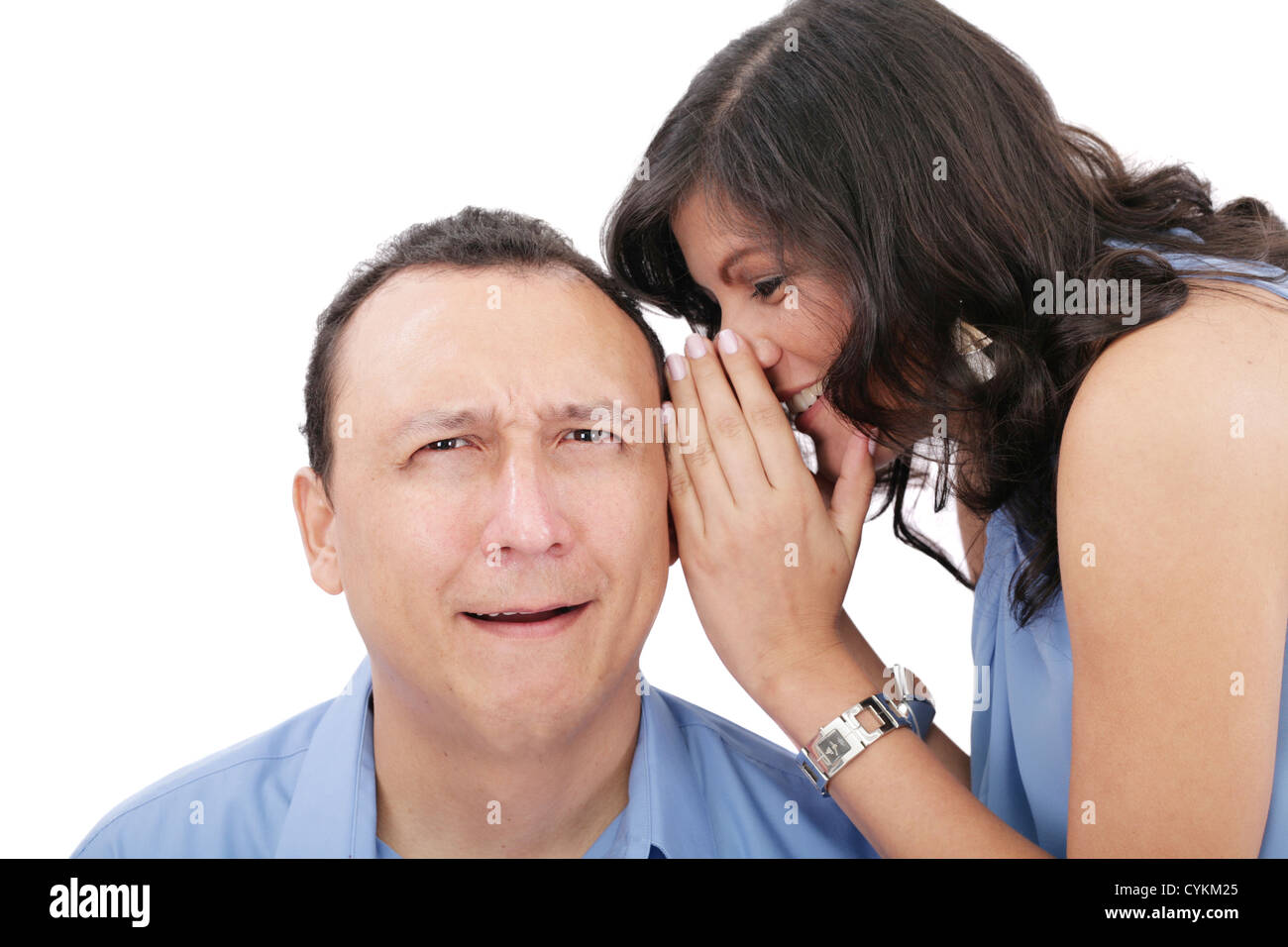 Beautiful brunette woman whispering into her boyfriends ear Stock Photo ...