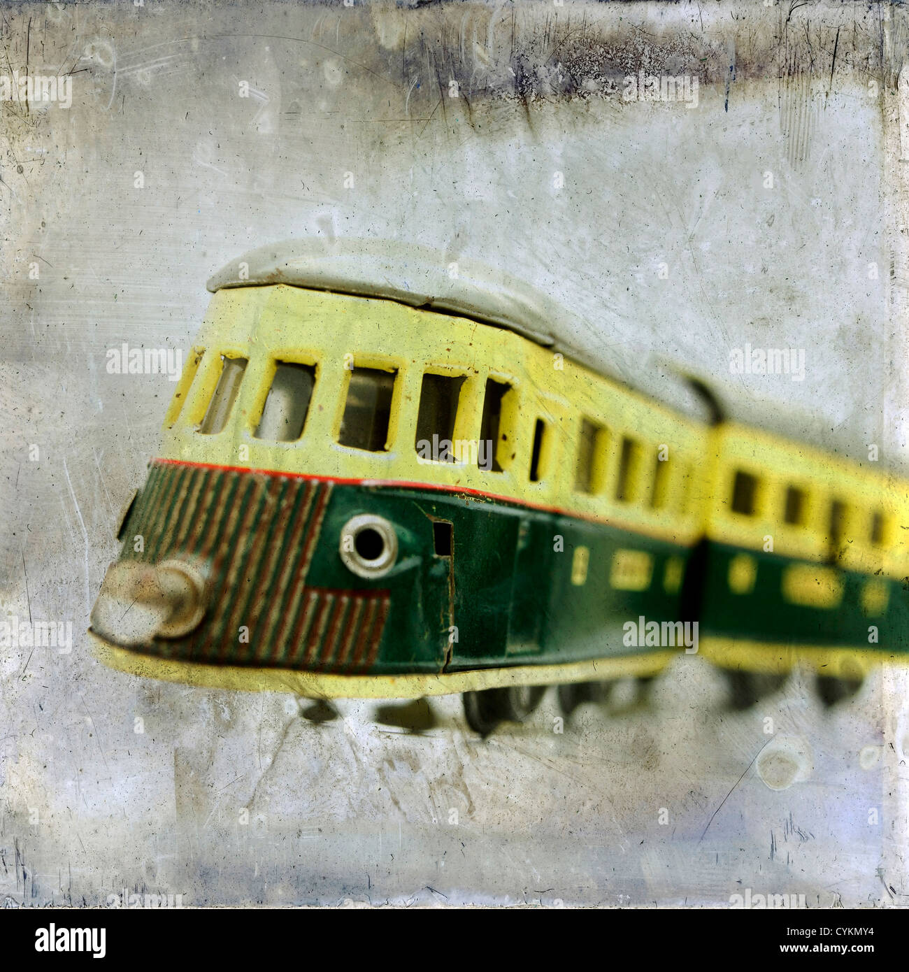 Vintage toy train with a green and yellow design featuring detailed ...