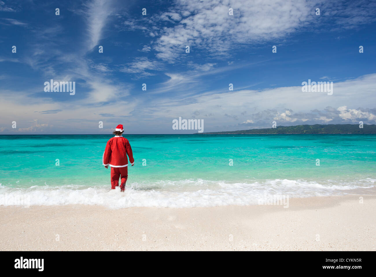Santa Claus is going in to Ocean Stock Photo - Alamy