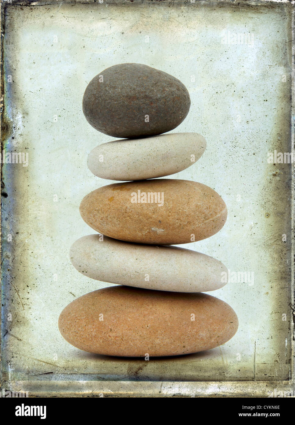 Stack of smooth stones arranged in balanced formation on white ...