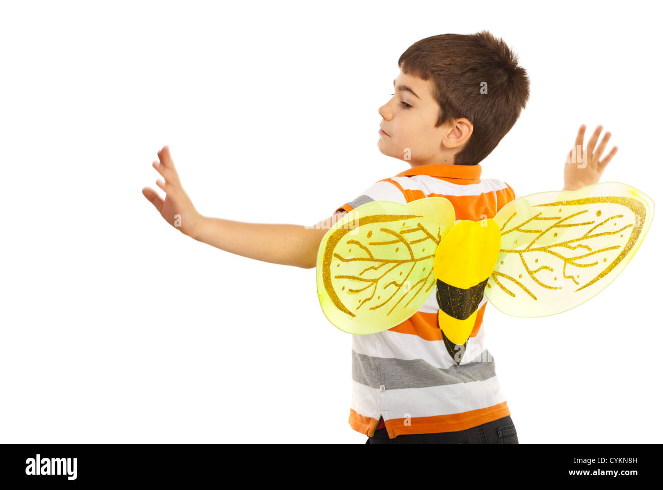 Child boy with bee wings trying to fly isolated on white background ...