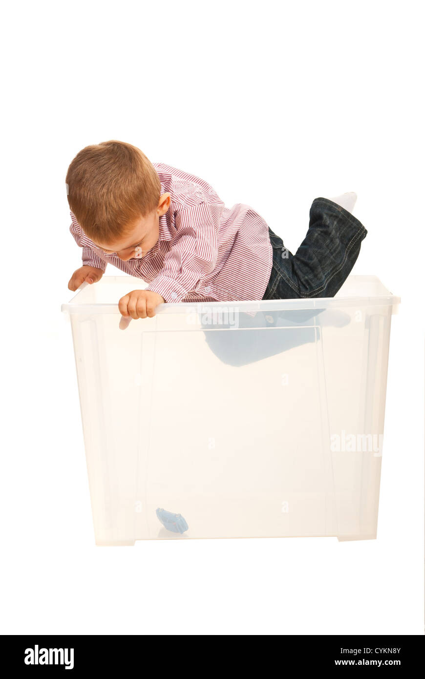 Toddler boy jump in a transparent box isolated on white background ...