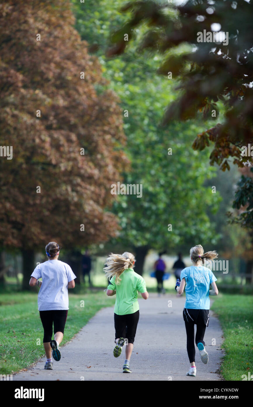 WOMEN RUNNING IN A PARK Stock Photo - Alamy