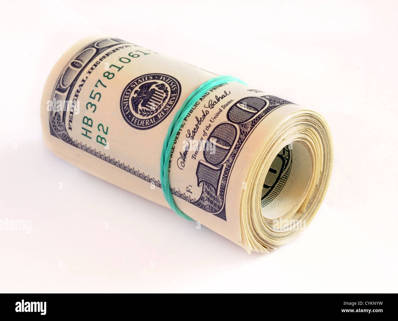 Roll of money isolated on white background Stock Photo - Alamy