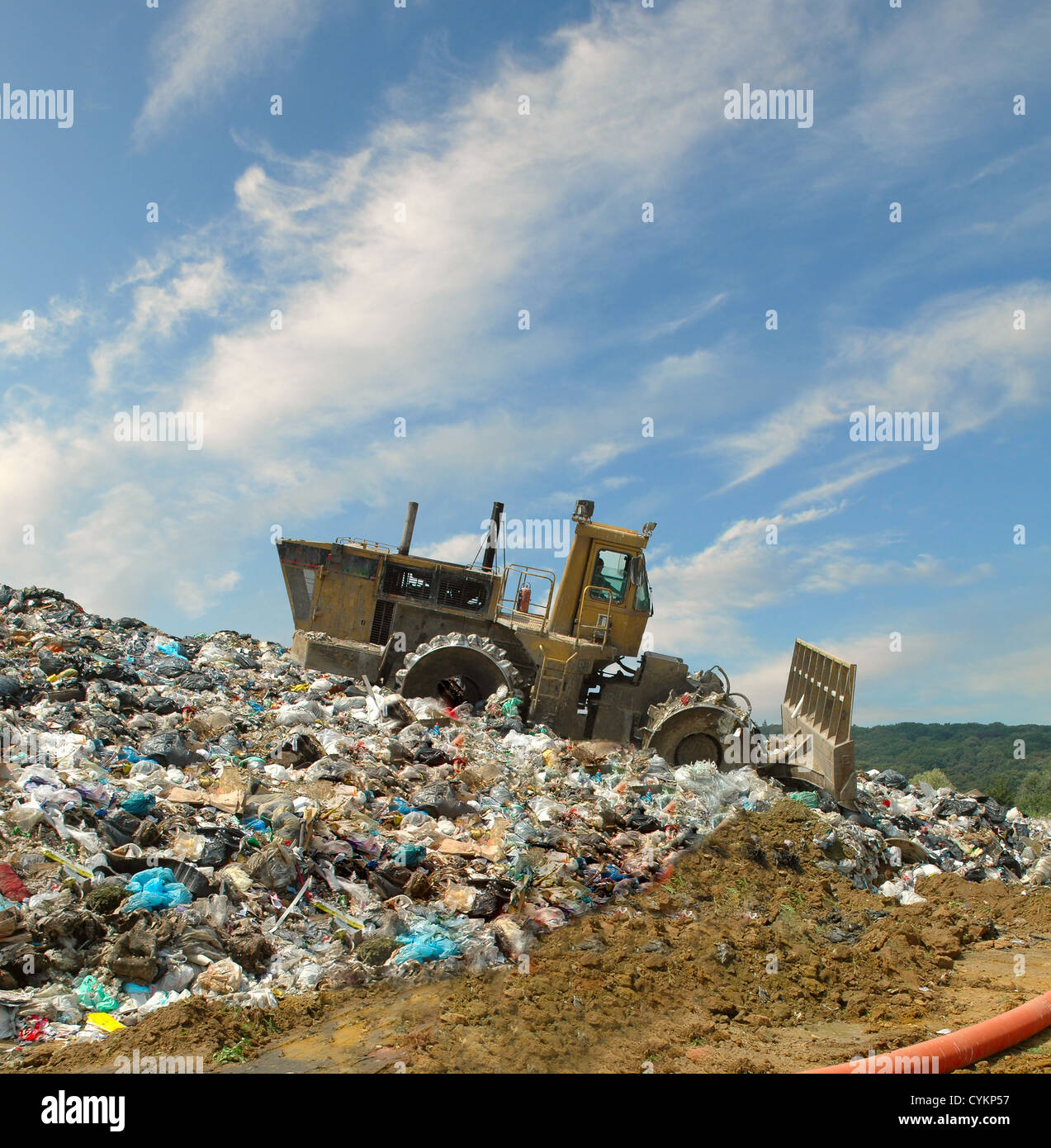 The bulldozer buries food and industrial wastes Stock Photo - Alamy