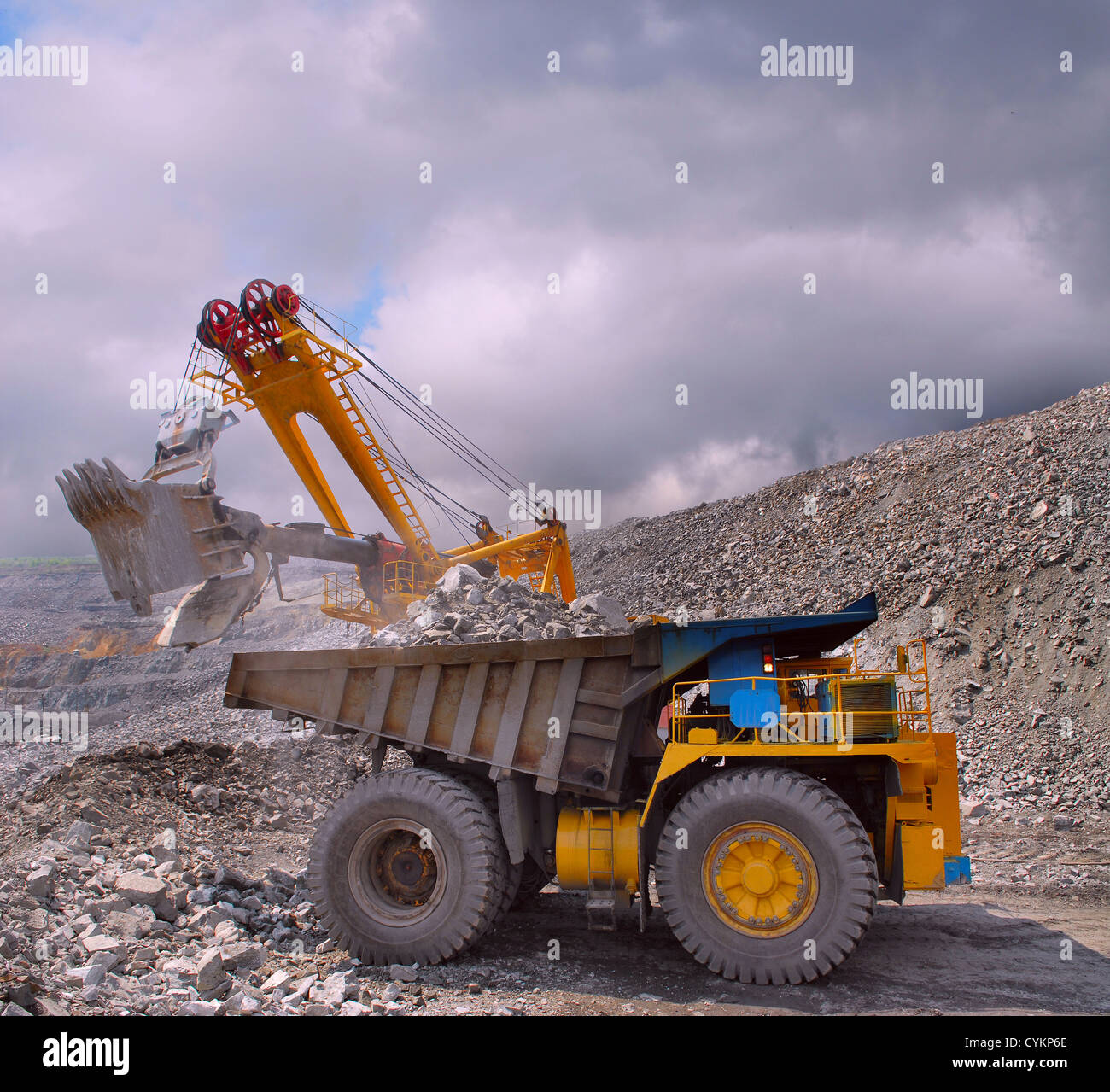 Loading of iron ore on very big dump-body truck Stock Photo - Alamy