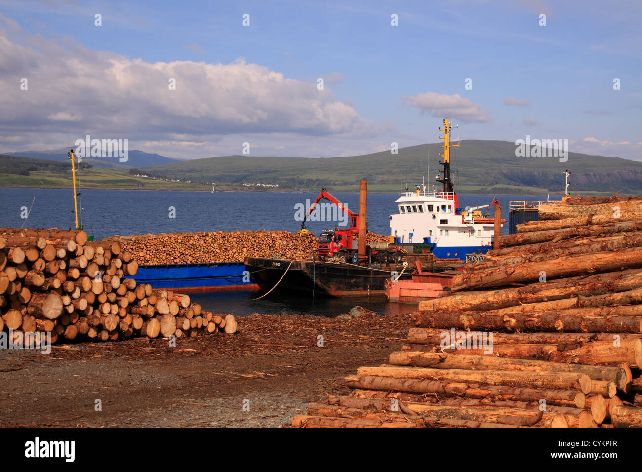 UK Scotland Isle of Mull loading timber onto ship Stock Photo - Alamy