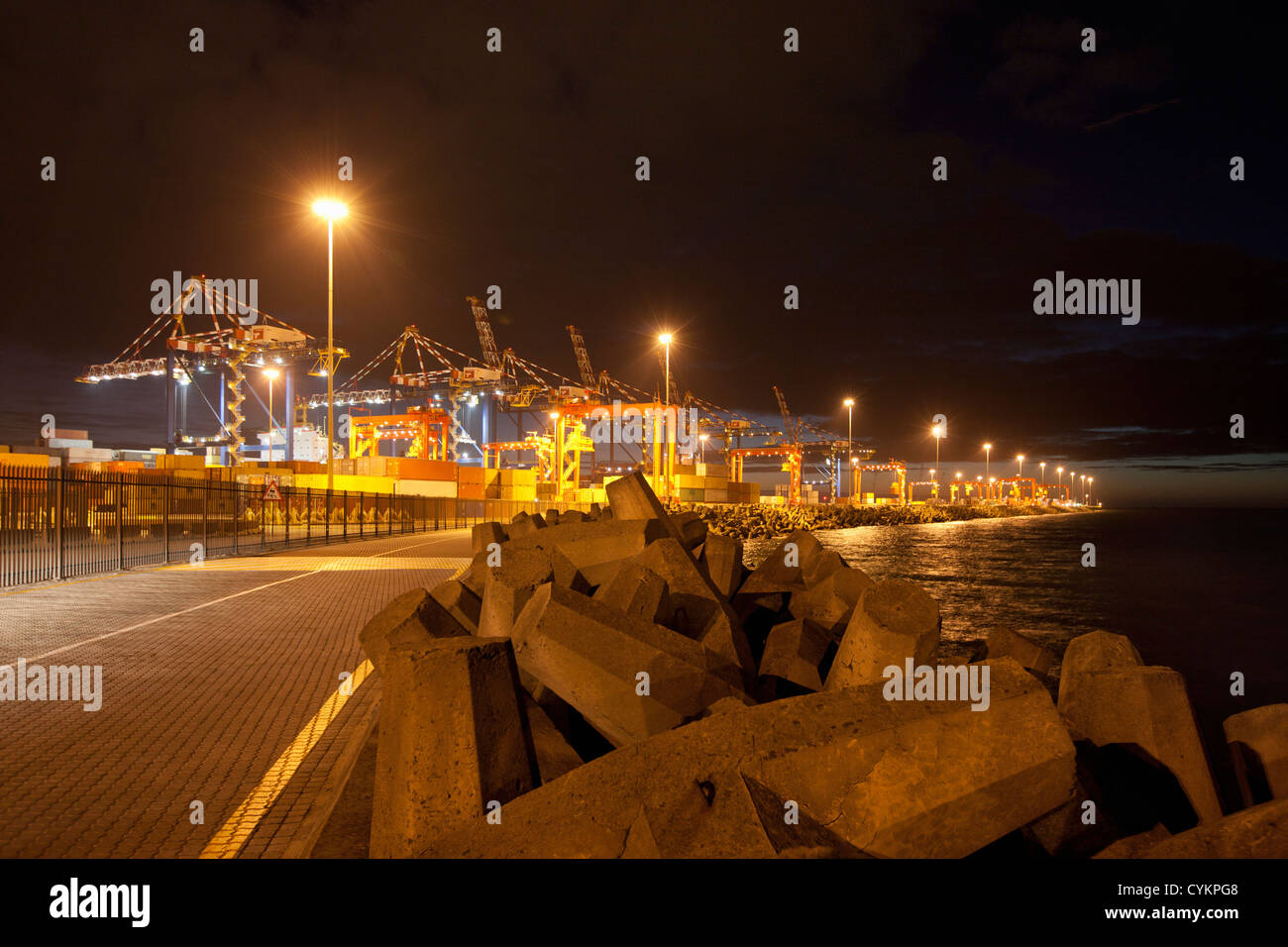 Cranes and containers in shipyard Stock Photo - Alamy