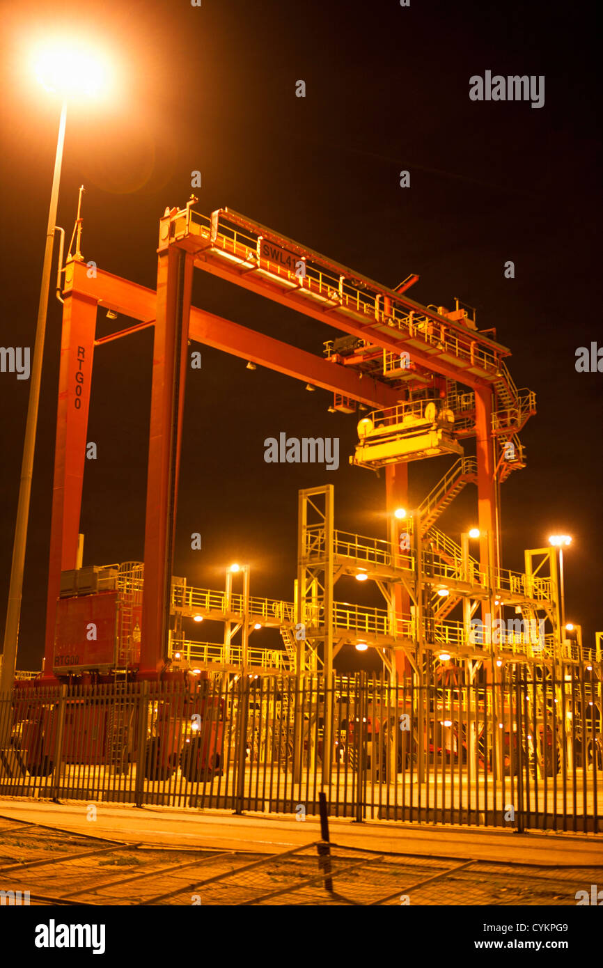 Cranes and ladders in shipyard at night Stock Photo - Alamy