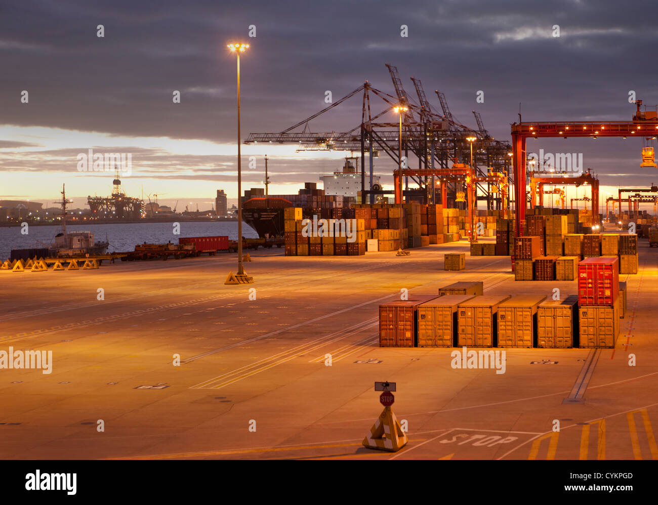 Cranes and containers in shipyard Stock Photo - Alamy
