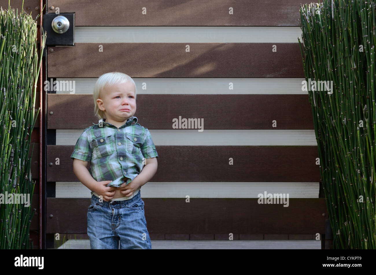Toddler boy crying outdoors Stock Photo - Alamy