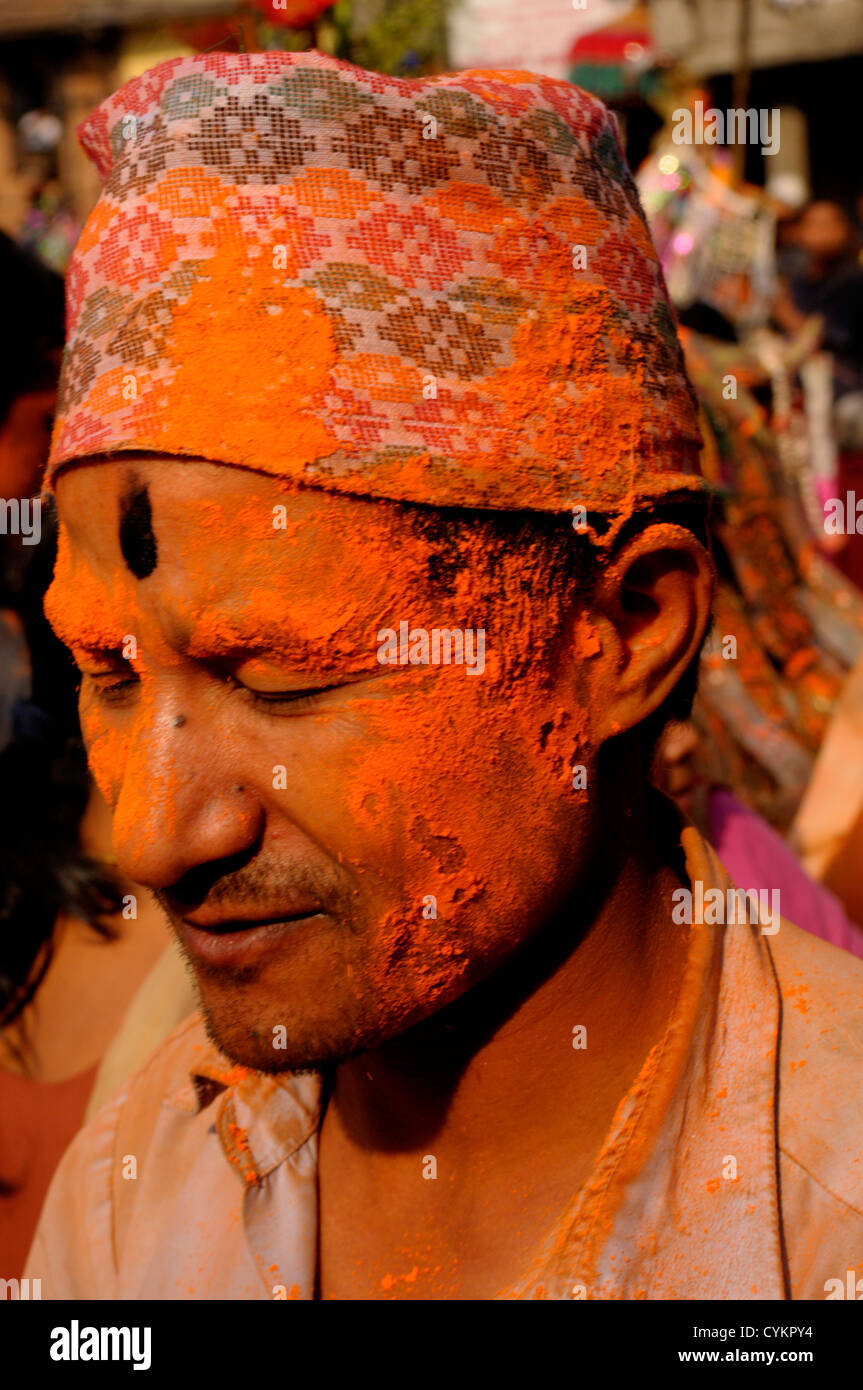 Nepali man covered in orange powder at the bisket jatra festival in ...