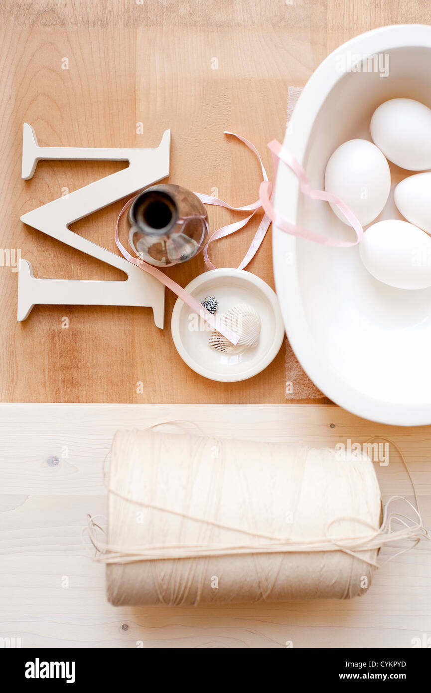 Twine letter M ribbon and eggs Stock Photo - Alamy