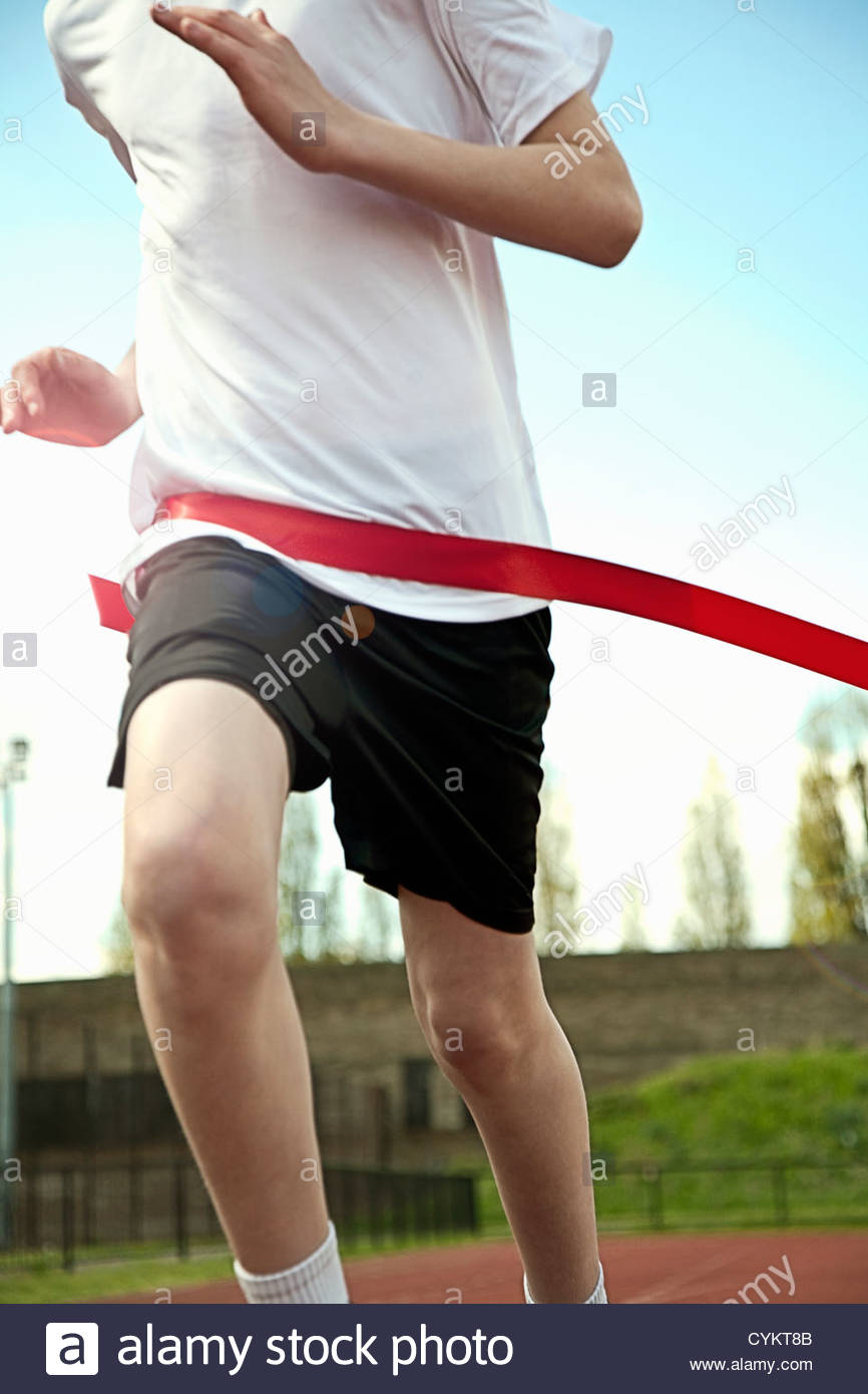 Runner Breaking The Tape Stock Photos & Runner Breaking The Tape Stock ...