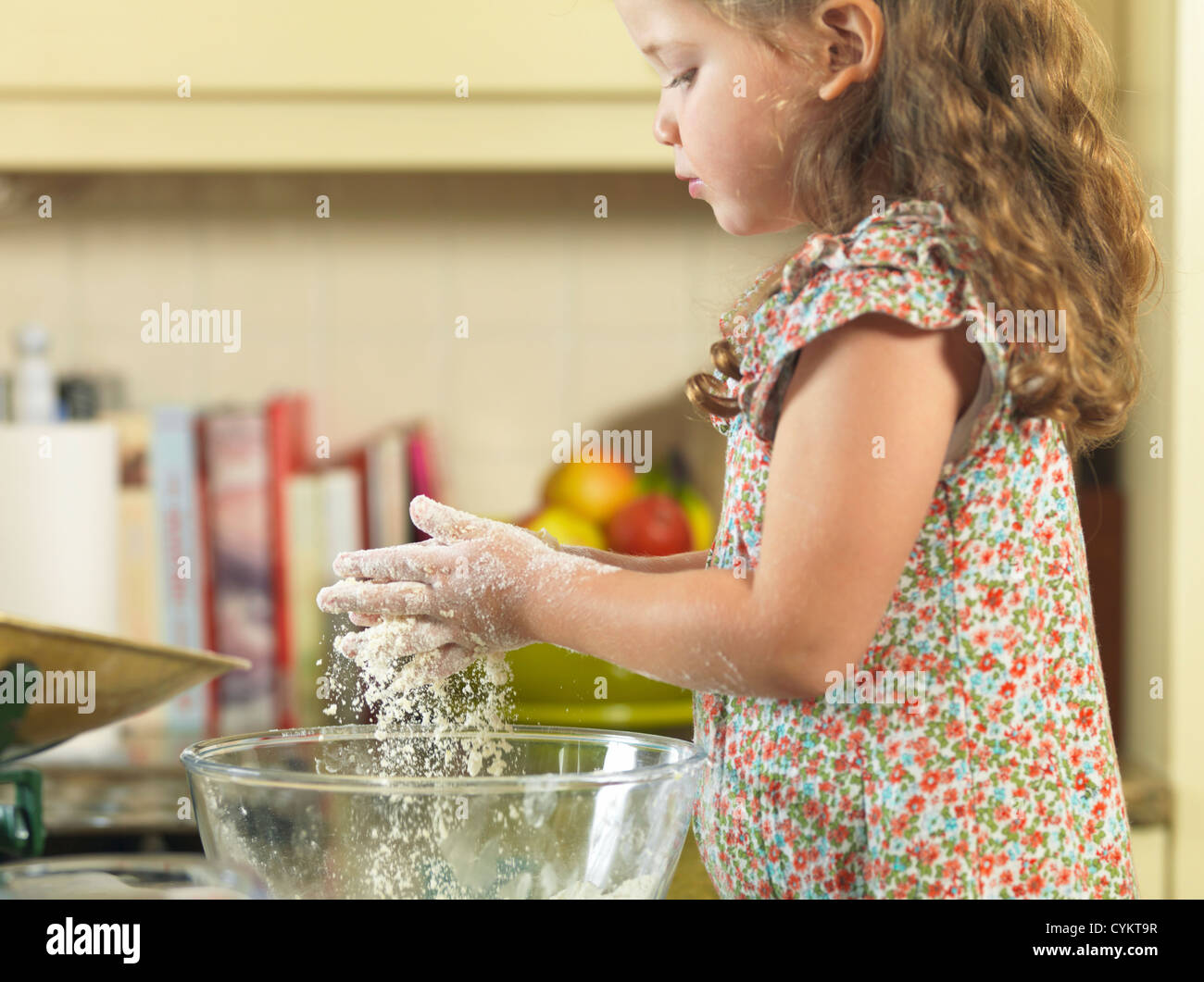 Girl baking in kitchen Stock Photo - Alamy