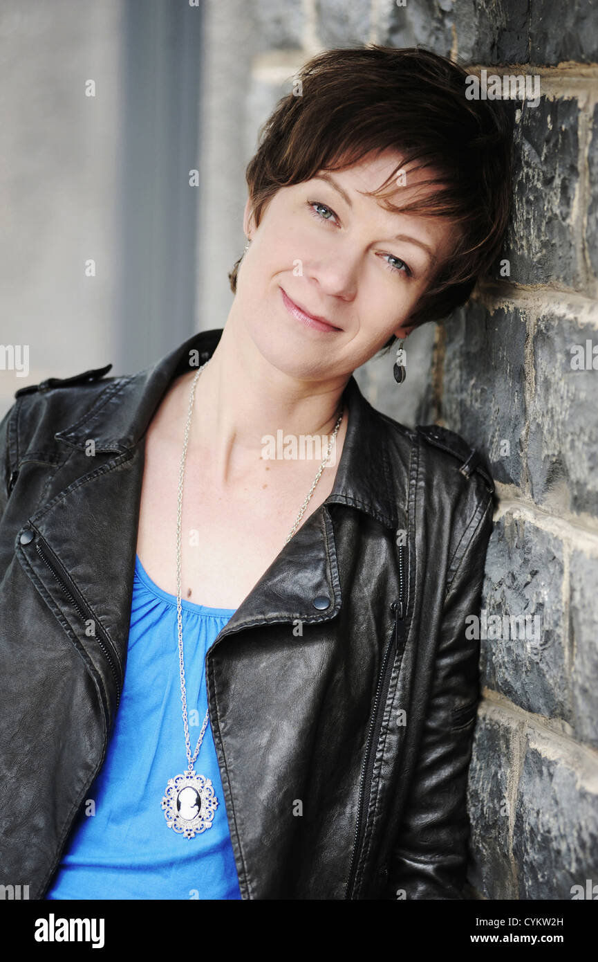 Posing female against brick wall hi-res stock photography and images ...