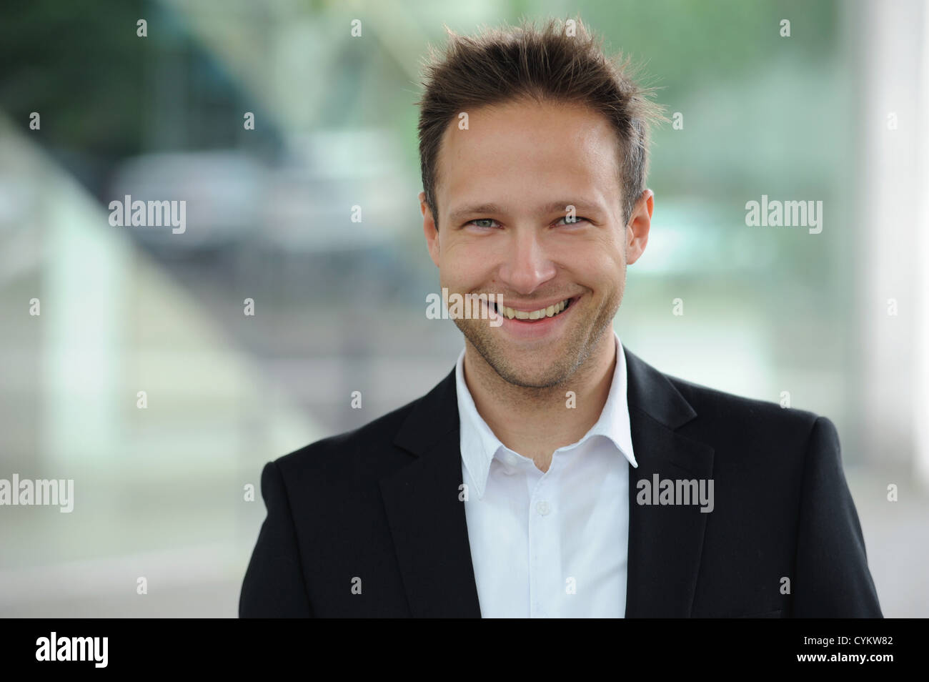 Jolly brunette man smiling standing hi-res stock photography and images ...