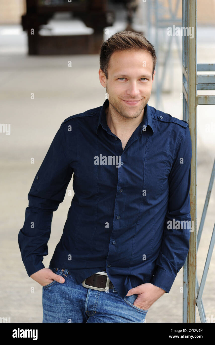Jolly brunette man smiling standing hi-res stock photography and images ...