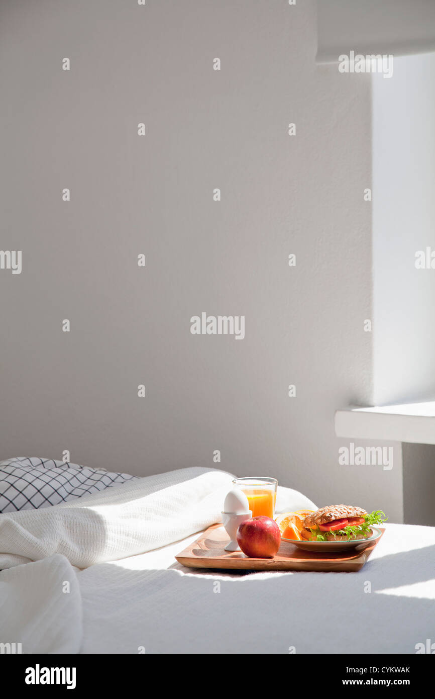 Tray of breakfast food on bed Stock Photo - Alamy