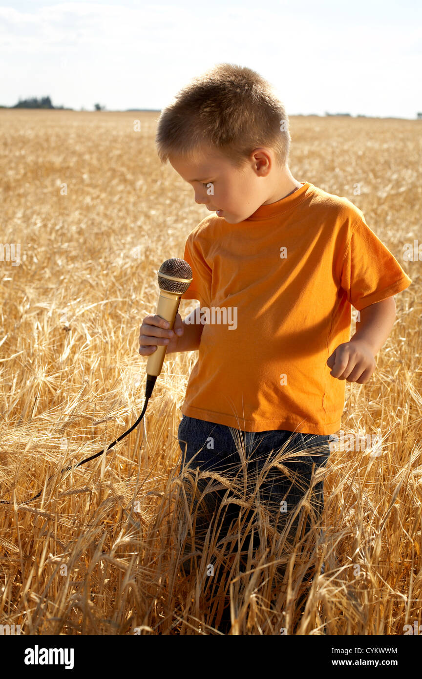 little singer at the field Stock Photo - Alamy