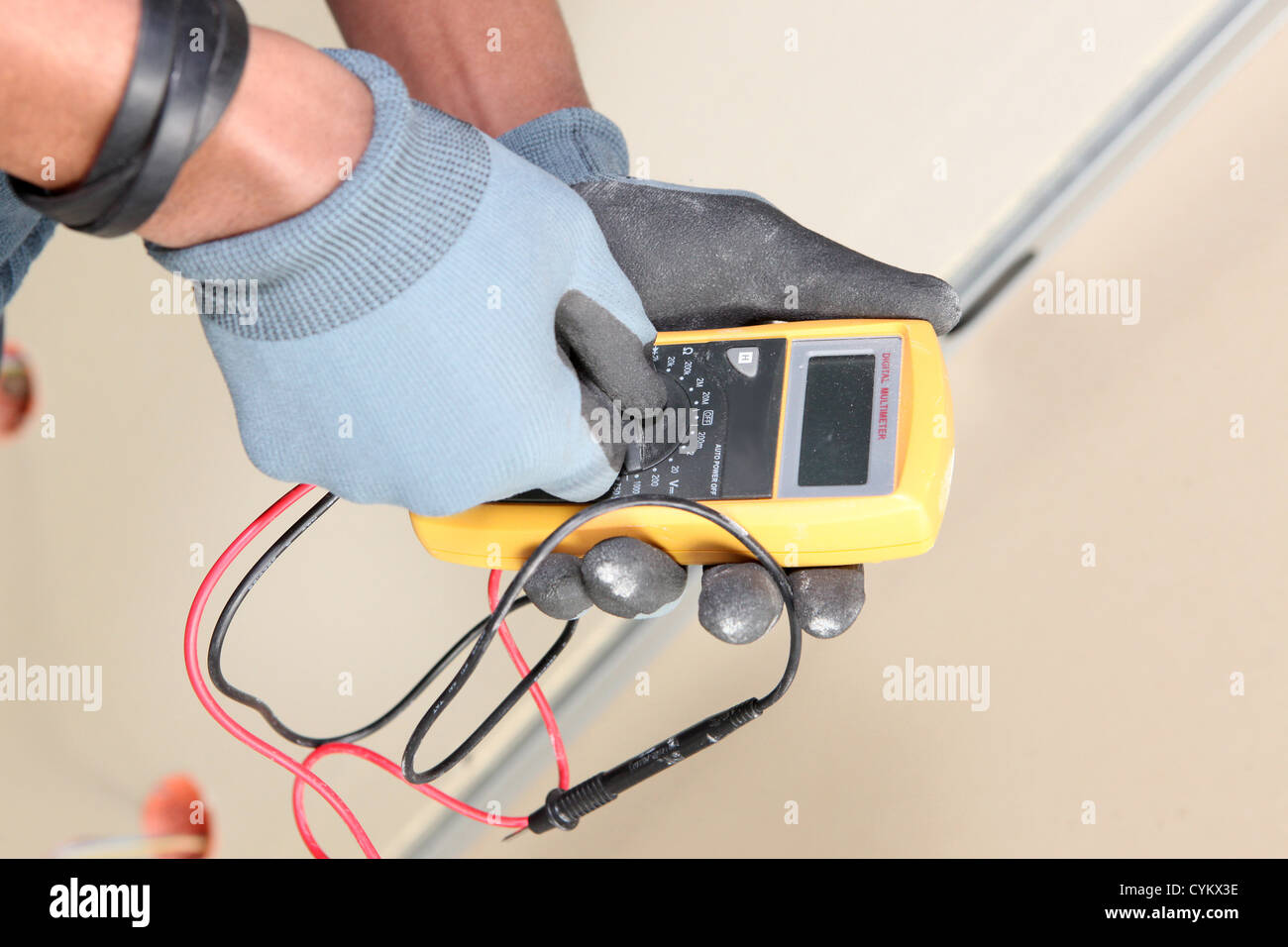 Electrician using voltmeter Stock Photo - Alamy