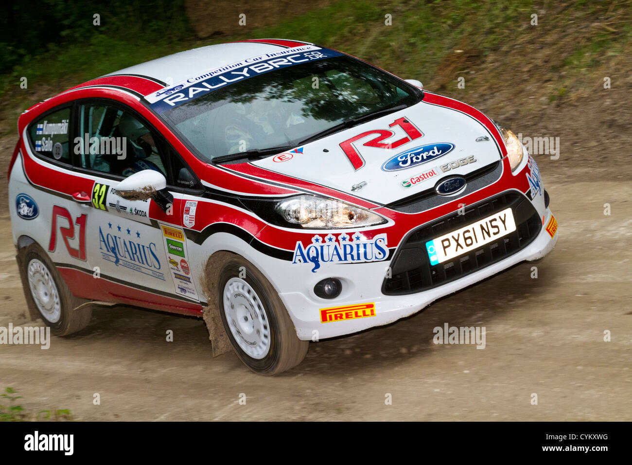 2011 Ford Fiesta R2 with driver Jussi Kumpumaki on the rally stage at ...