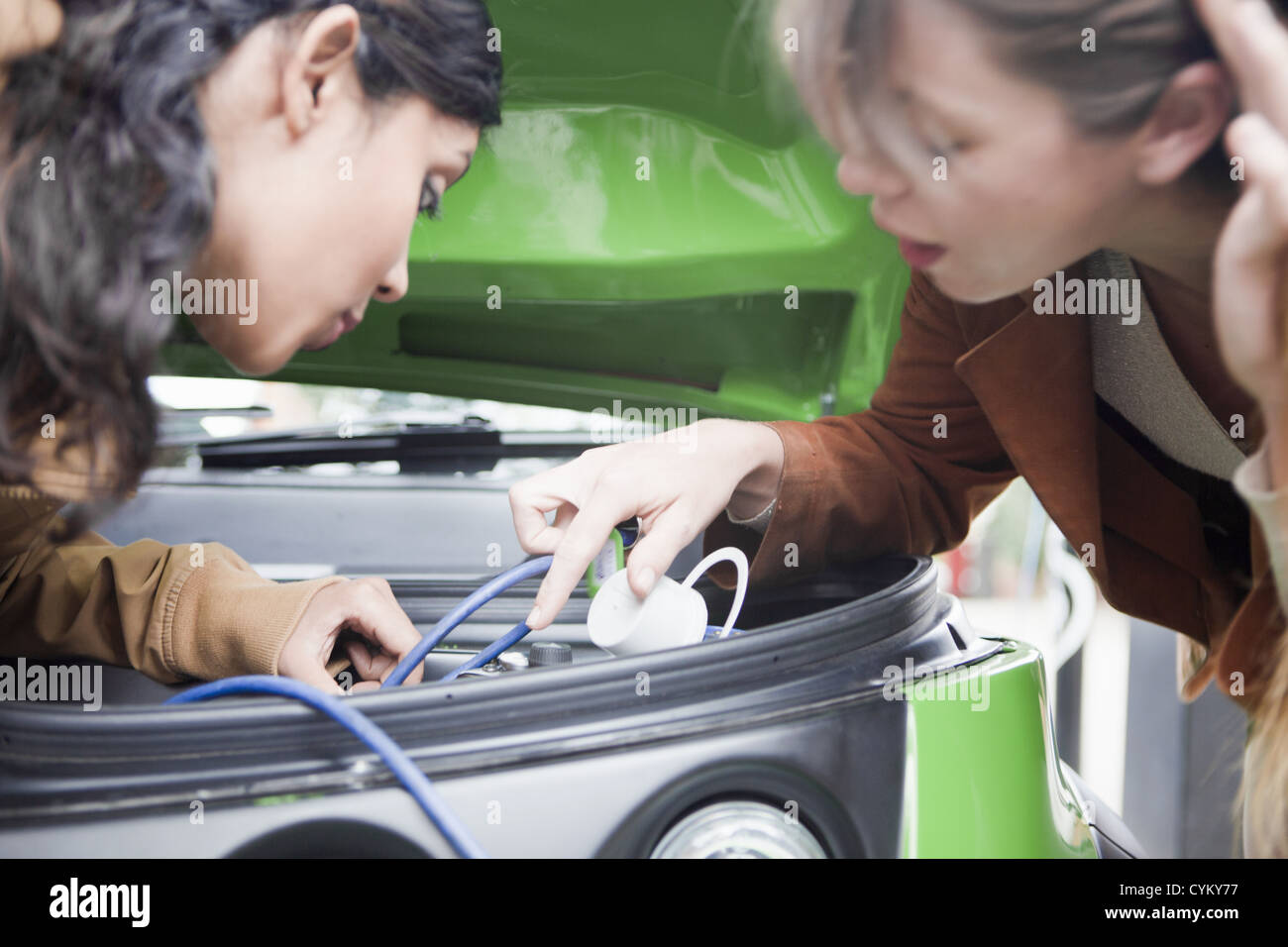 Plugging in an electric car hi-res stock photography and images - Alamy