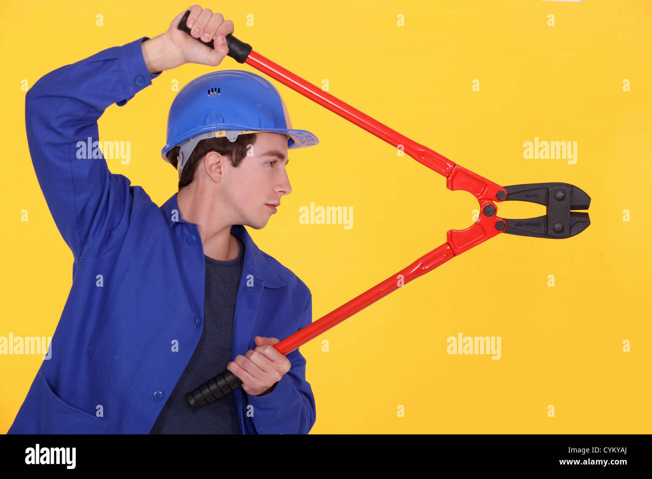 Man using bolt cutters Stock Photo - Alamy