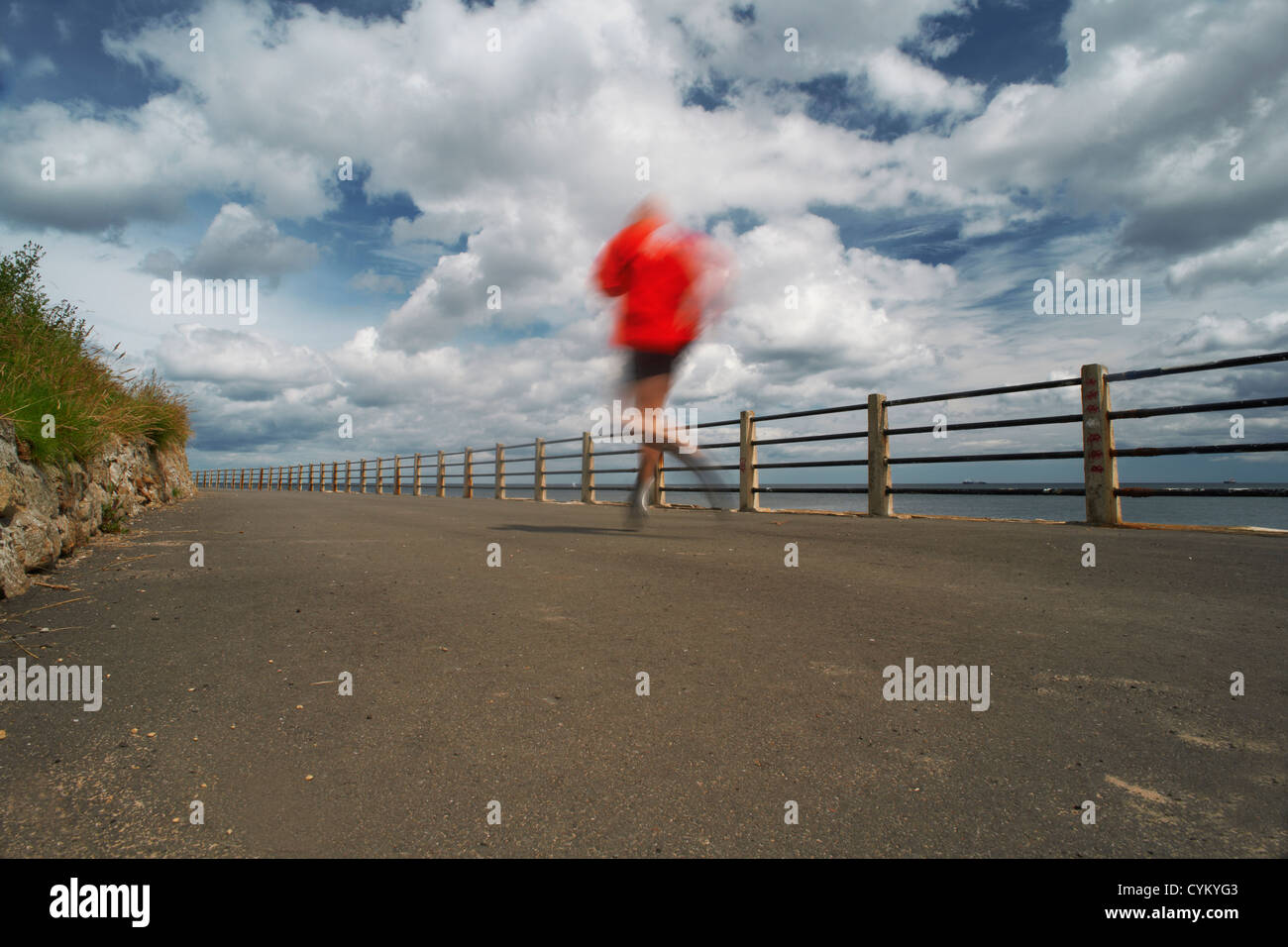 Running on coastal road person hi-res stock photography and images - Alamy