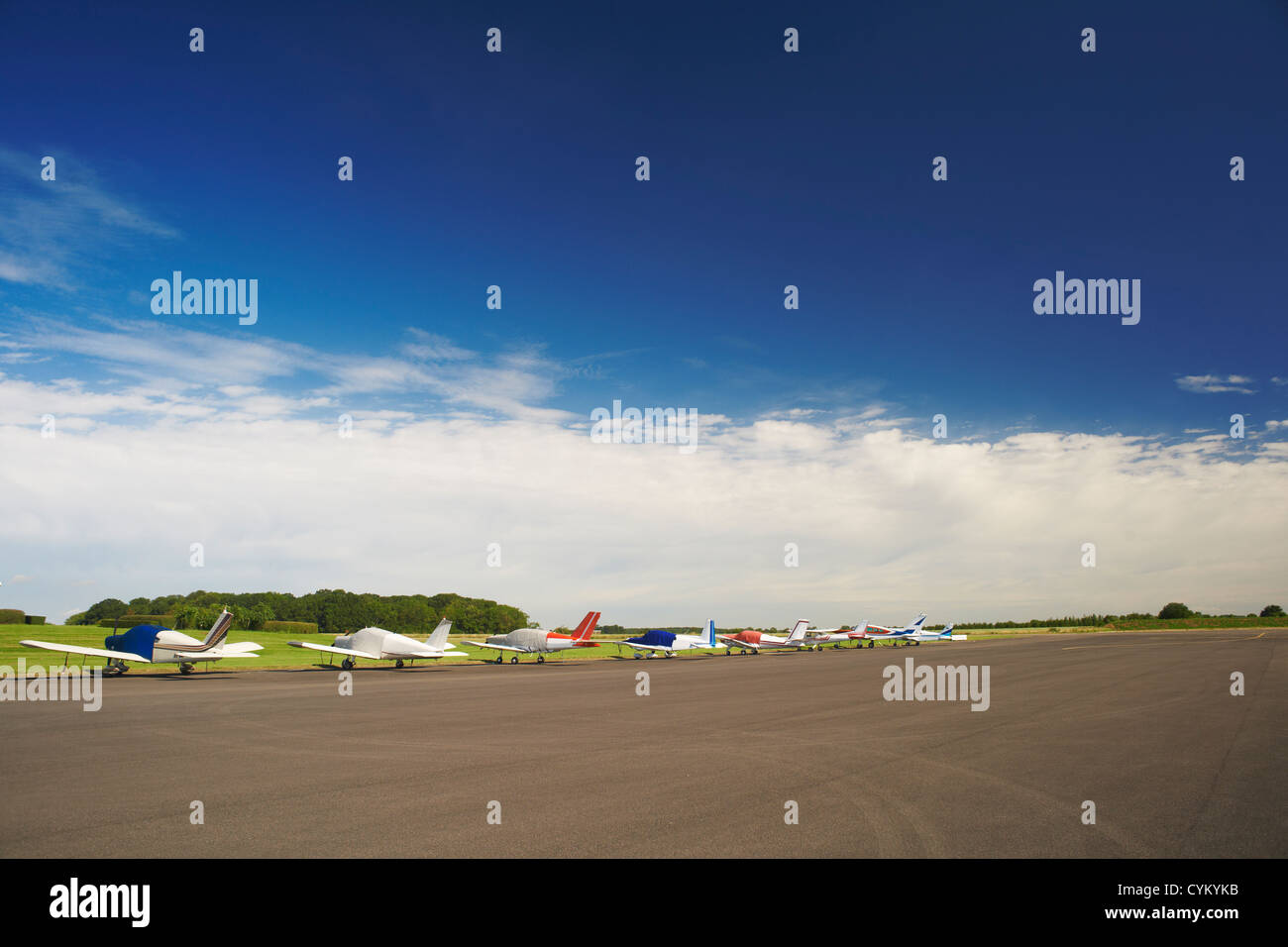 Airplanes parked on airstrip Stock Photo - Alamy