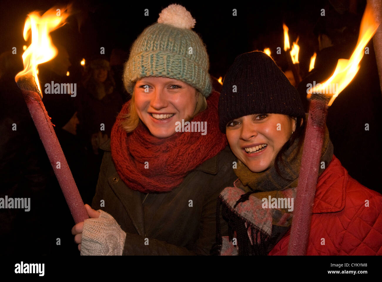 Two young women with lighted torches on bonfire night, Chiddingfold ...