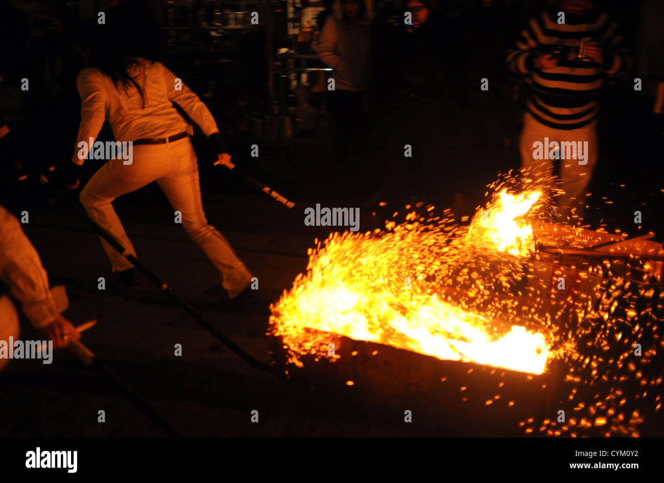 Sparks fly from the flaming tar barrel run at Lewes Bonfire ...