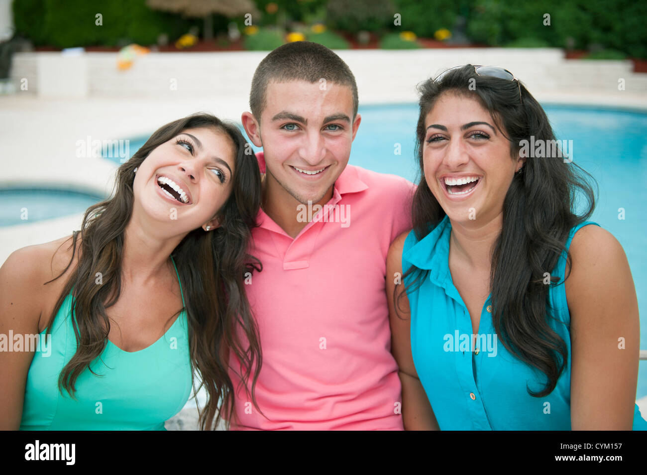 Brother and sisters smiling together Stock Photo - Alamy