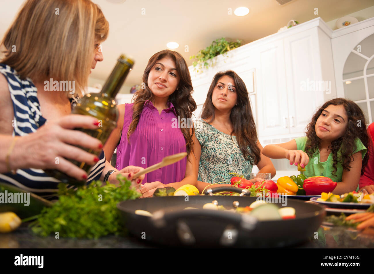 Women cooking together in kitchen Stock Photo - Alamy