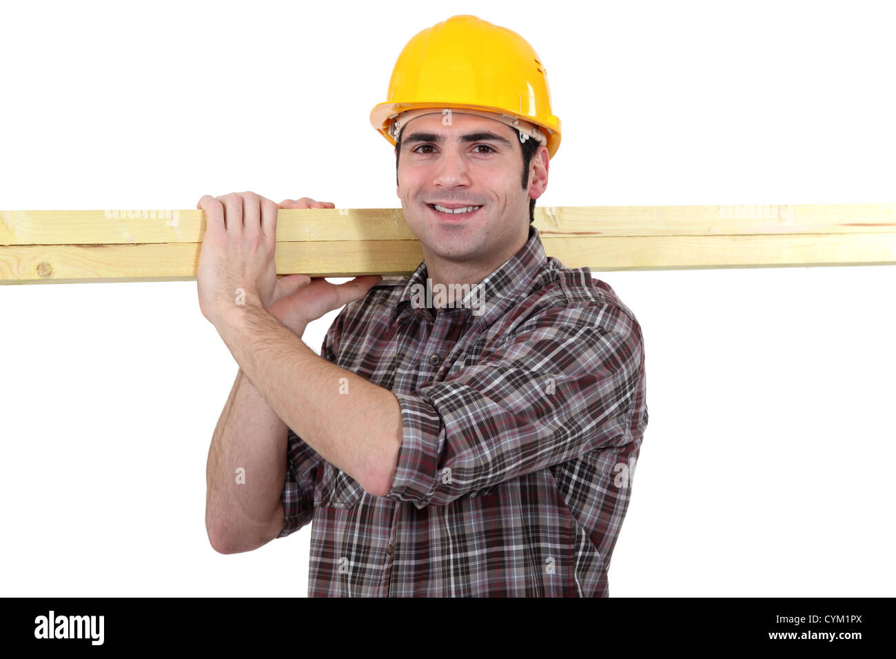 Builder carrying timber Stock Photo - Alamy