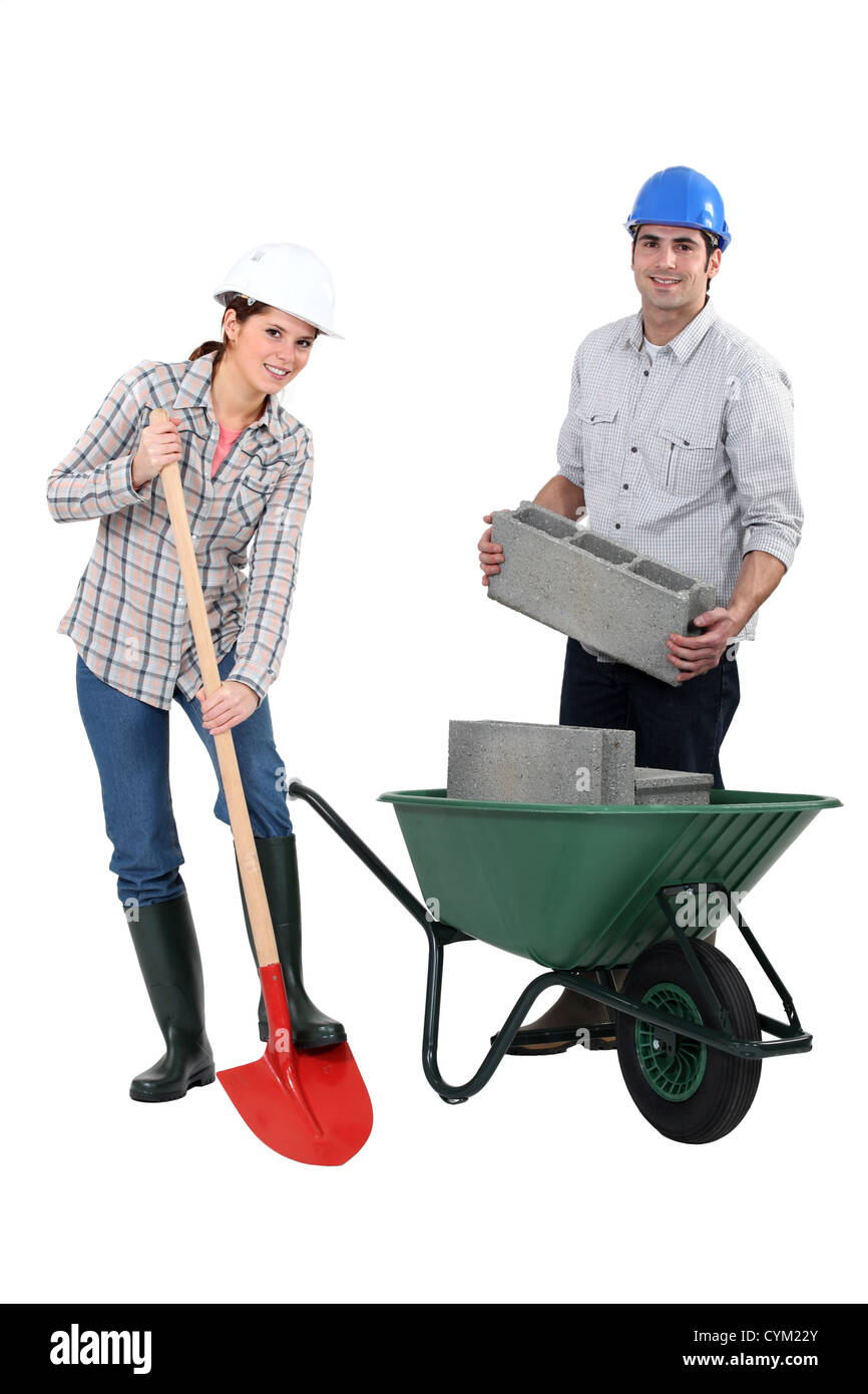 female bricklayer with shovel and male counterpart Stock Photo - Alamy