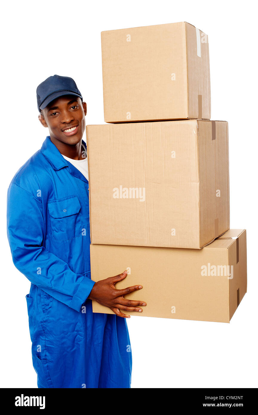 Young delivery guy holding stack of parcel boxes isolated against white ...