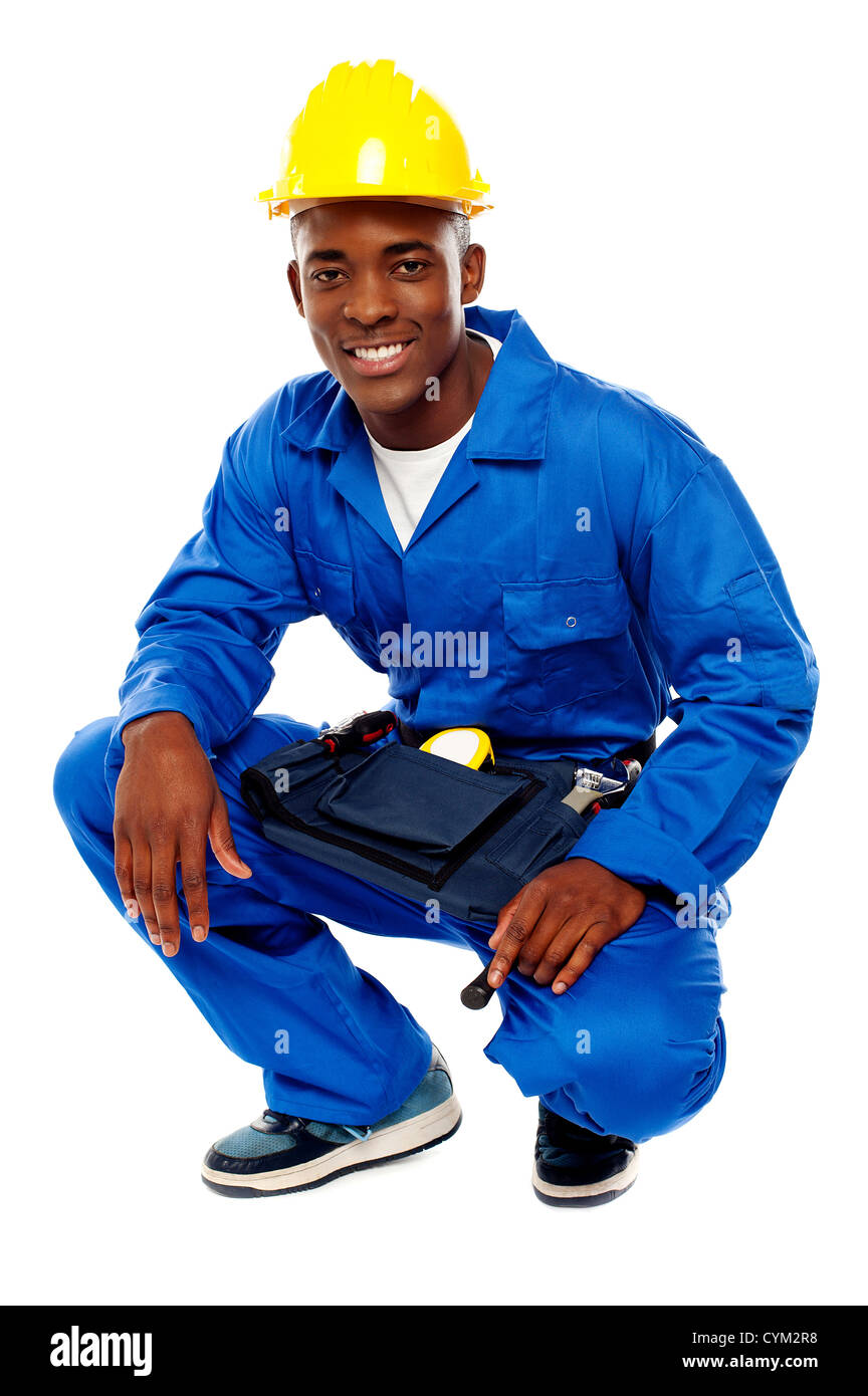 Seated african worker posing with a smile isolated over white ...