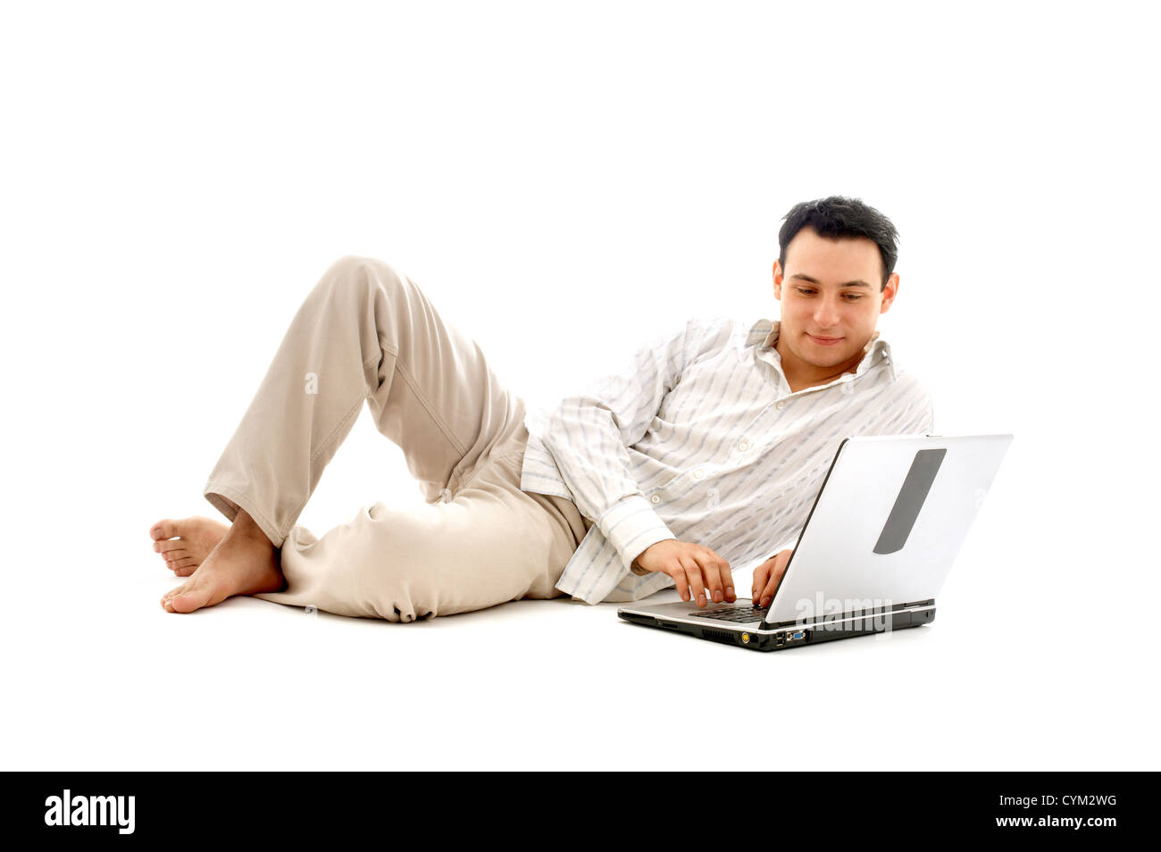 relaxed man with laptop computer over white Stock Photo - Alamy